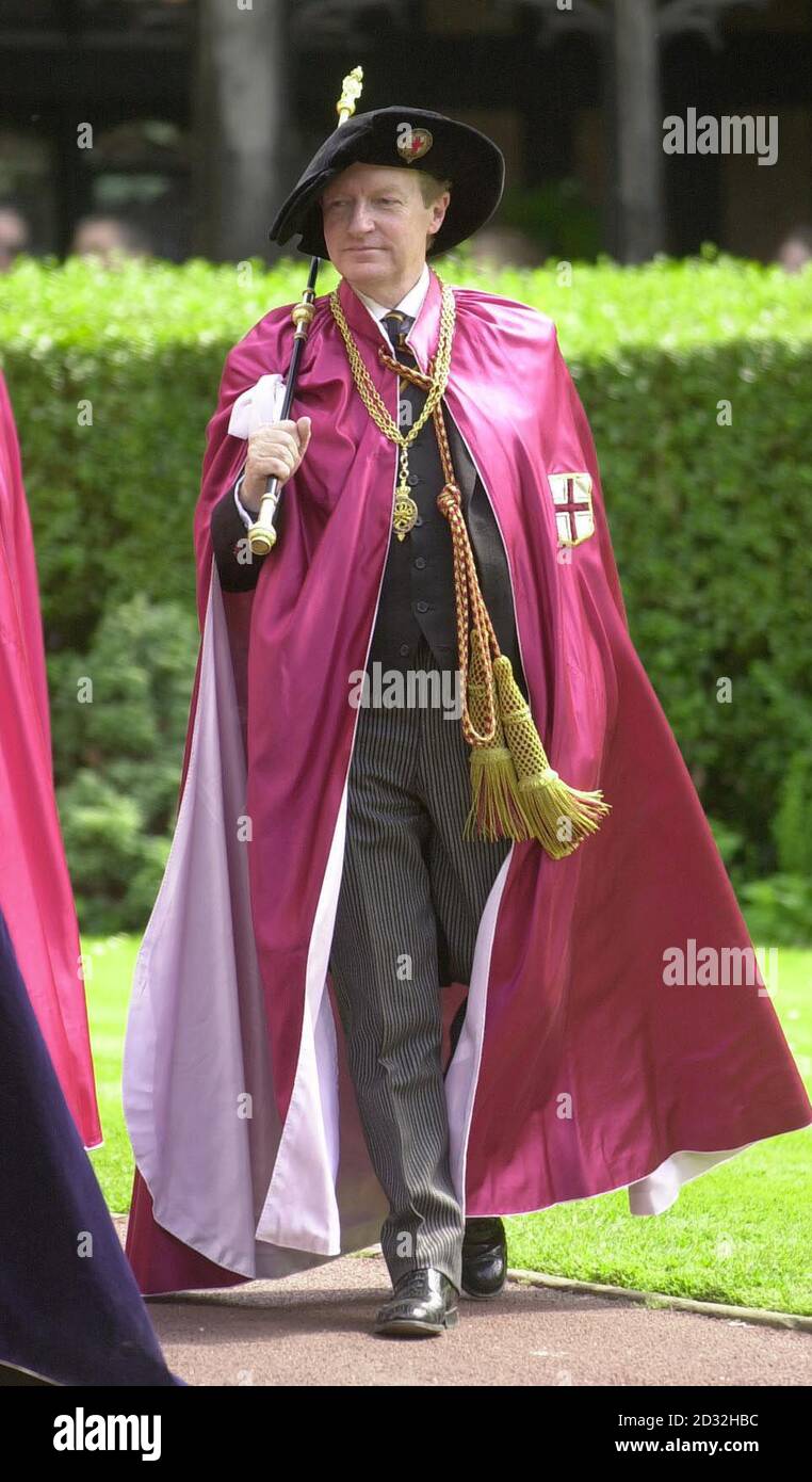 Black Rod, Sir Michael Willcocks, walks in the procession to St George ...