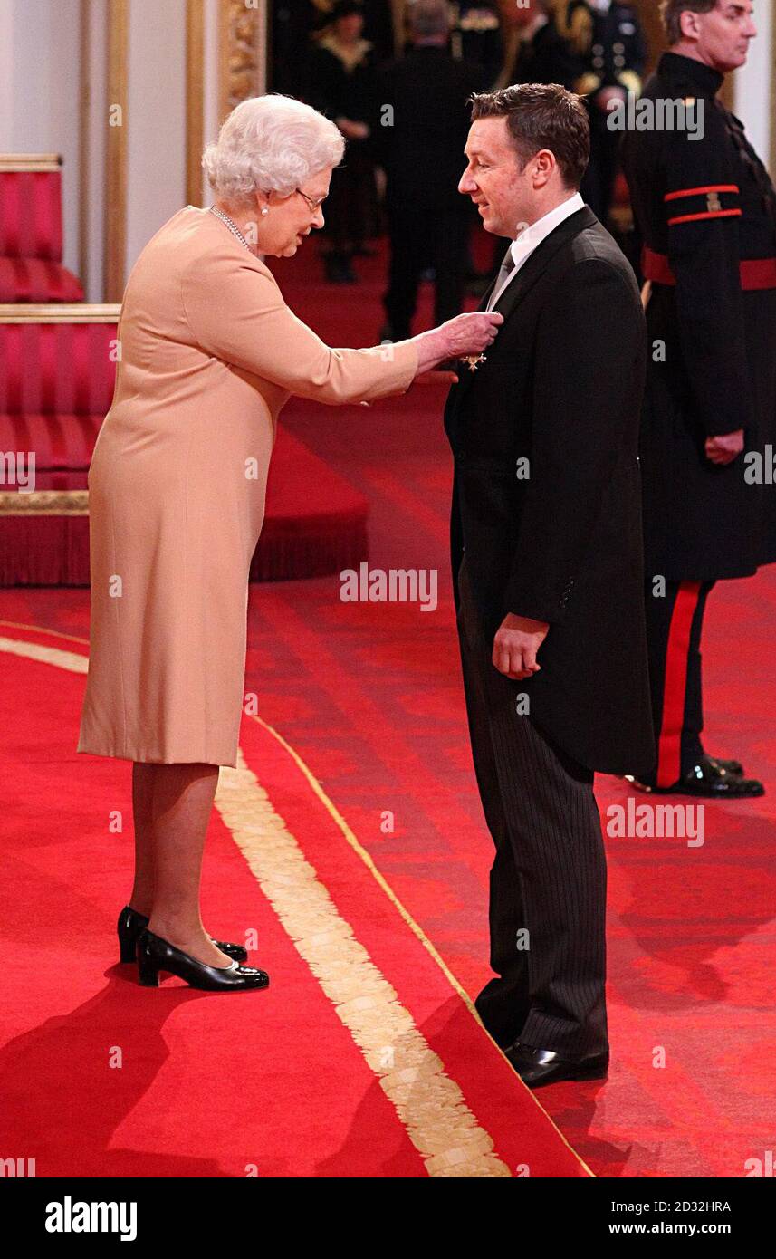 Robert Croft receives his Member of the British Empire (MBE) medal from ...