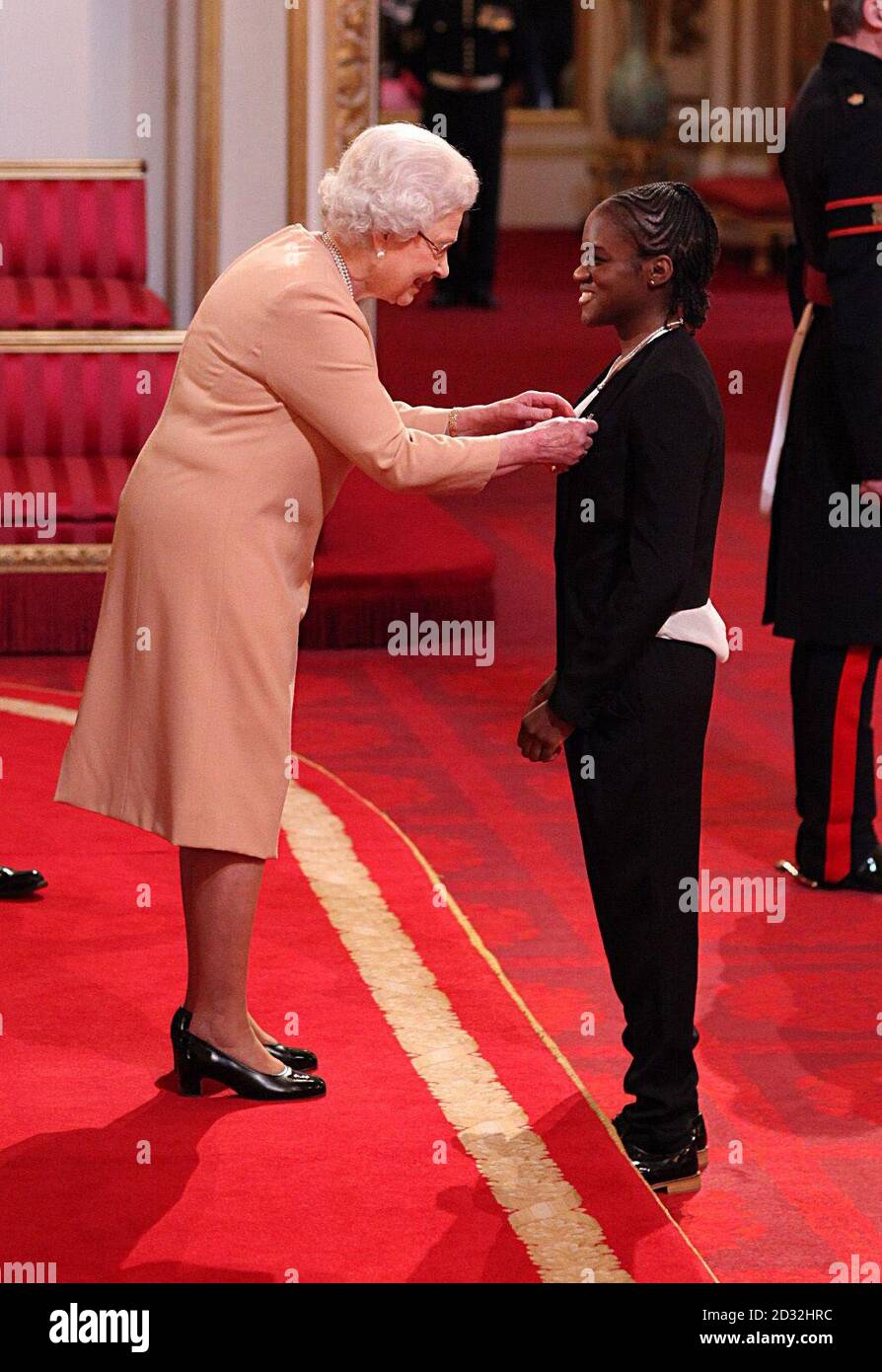 Nicola Adams receives her Member of the British Empire (MBE) medal from ...