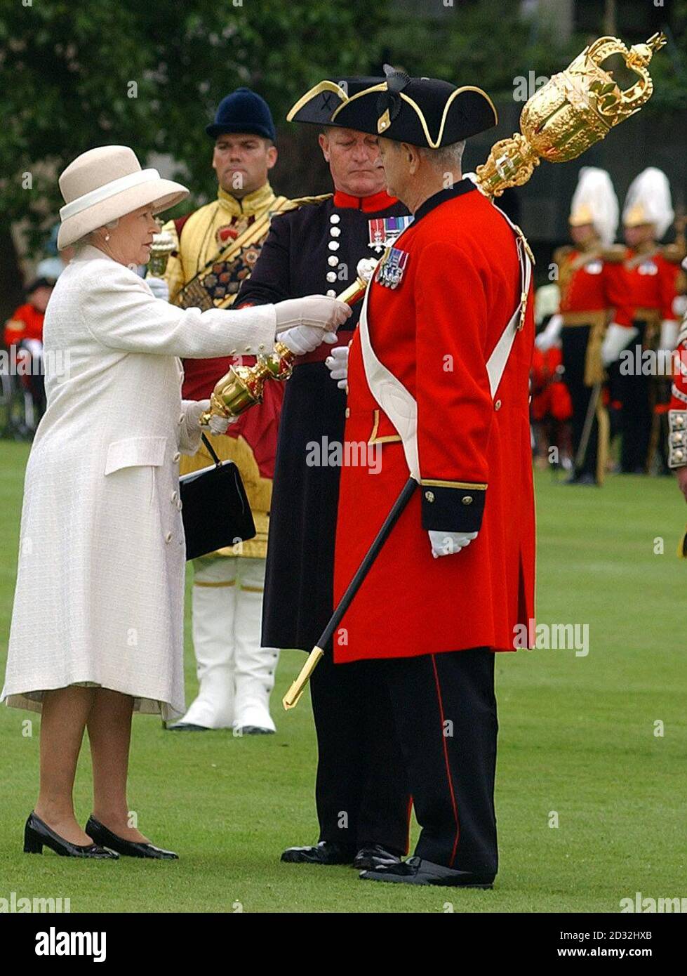 Queen Elizabeth II presents the Sovereign's Mace to a Chelsea Pensioner ...