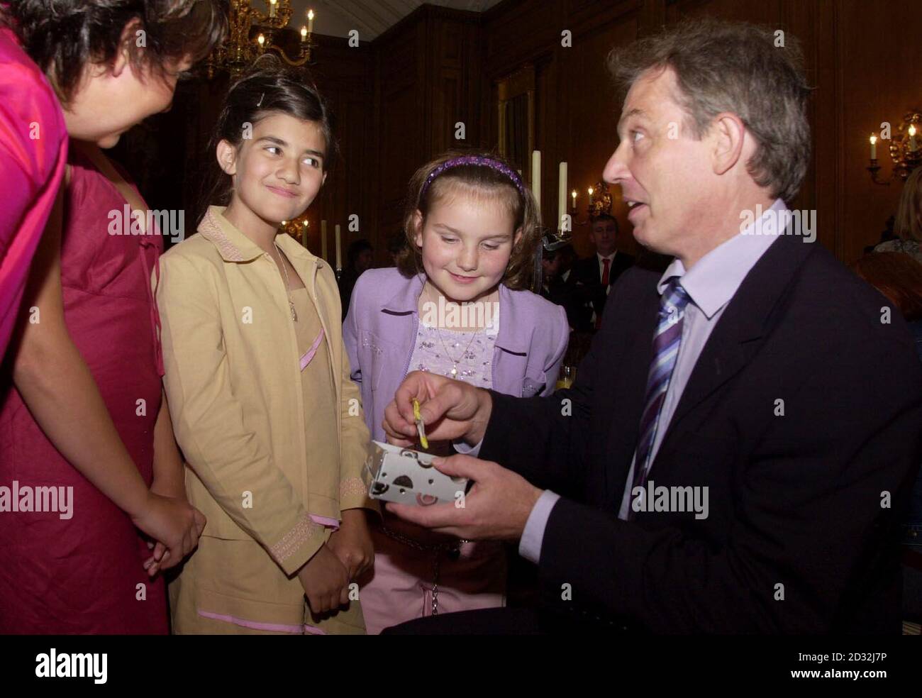 Prime Minister Tony Blair is given a present by Alice Maddocks (2nd ...