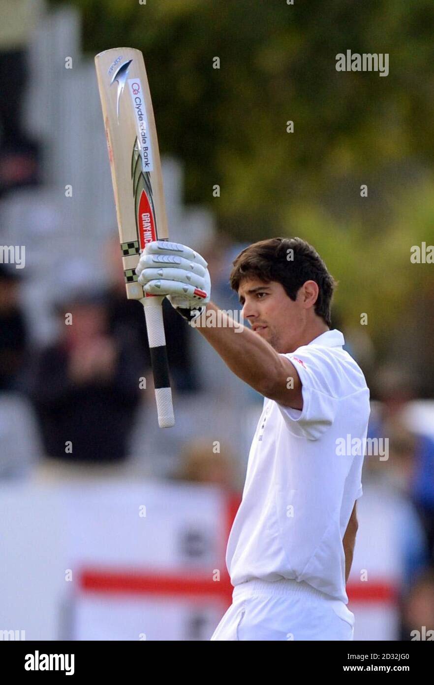 England's Alastair Cook celebrates scoring 100 not out during Day Four ...