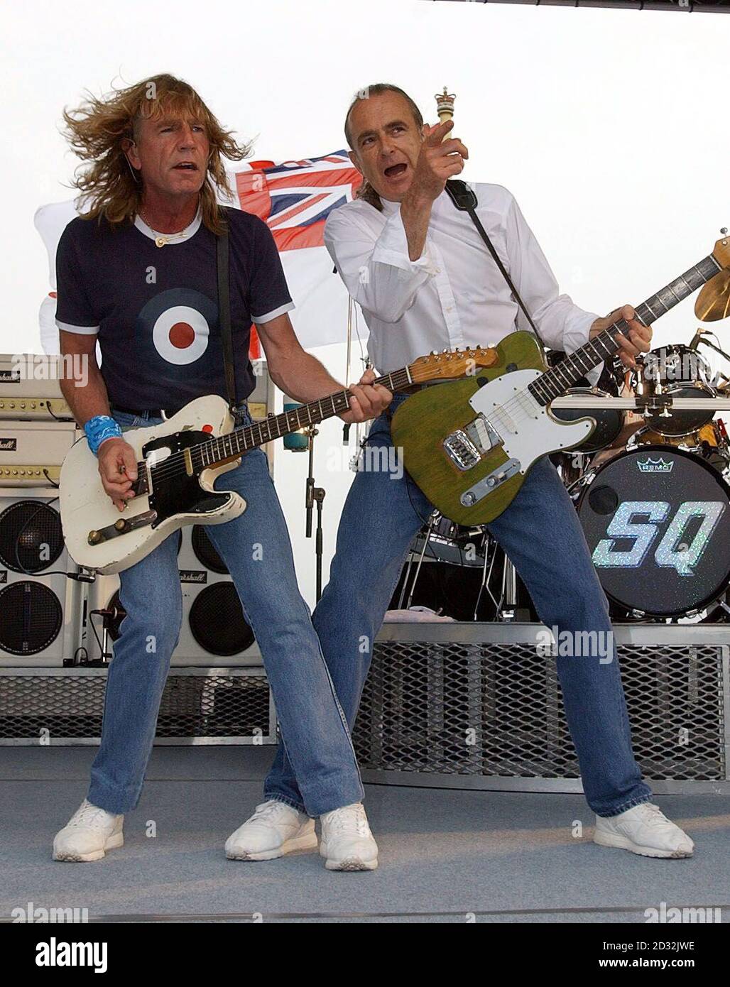 Rick Parfitt (left) and Francis Rossi of Status Quo play for fans and ...
