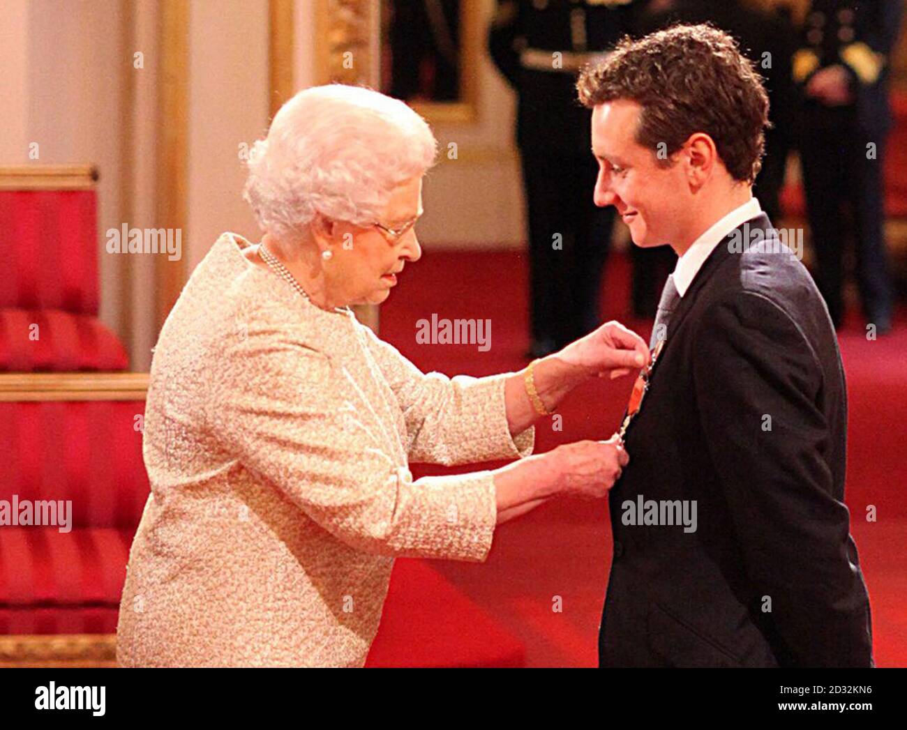 Triathlete Alistair Brownlee receiving his Member of the British Empire ...