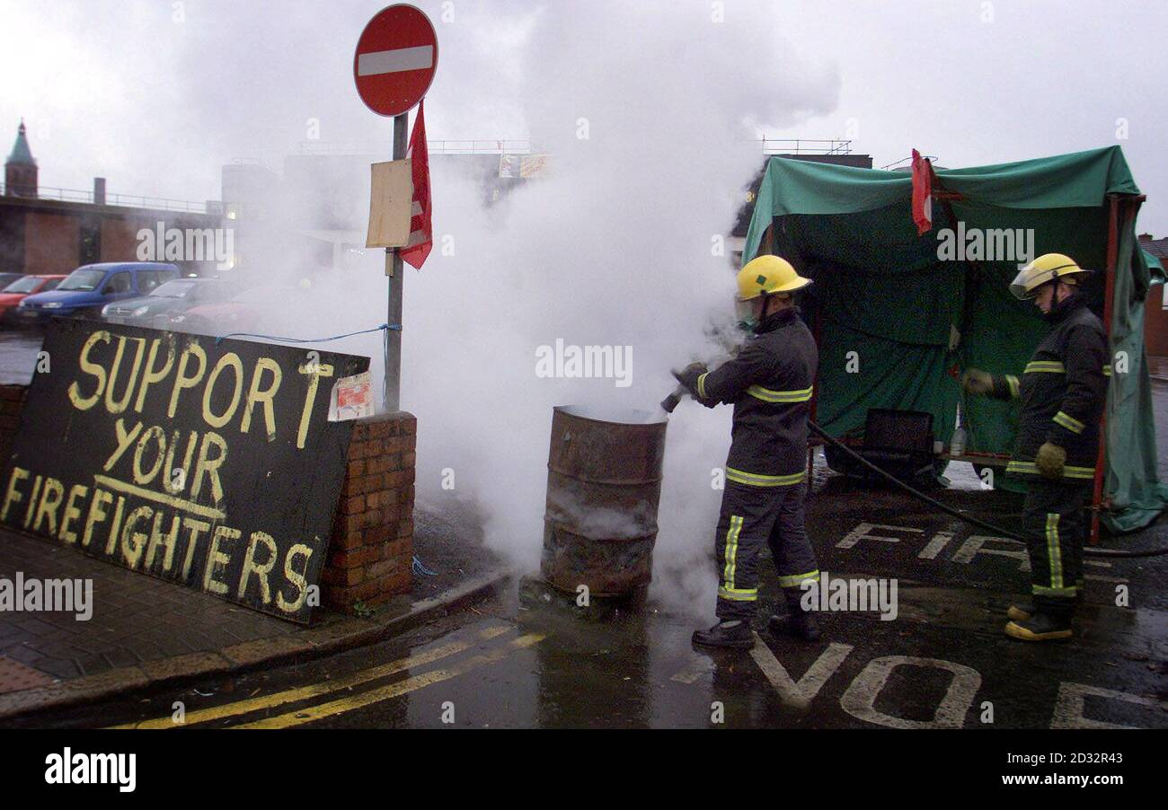 A Firefighter at Central Station in Belfast puts out the brazier in ...