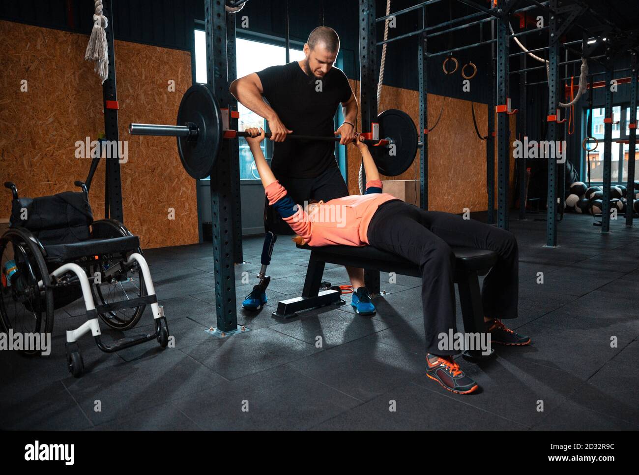 Weight. Disabled woman training in the gym of rehabilitation center ...