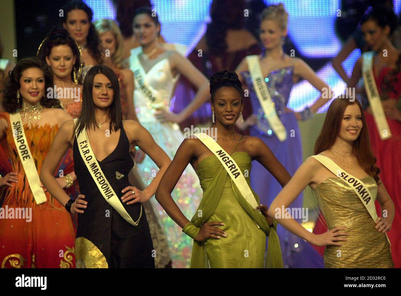 Beauty contestants in the 2002 Miss World competition parade being ...