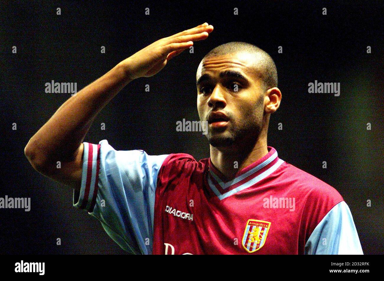 Football action arm raised hi-res stock photography and images - Alamy