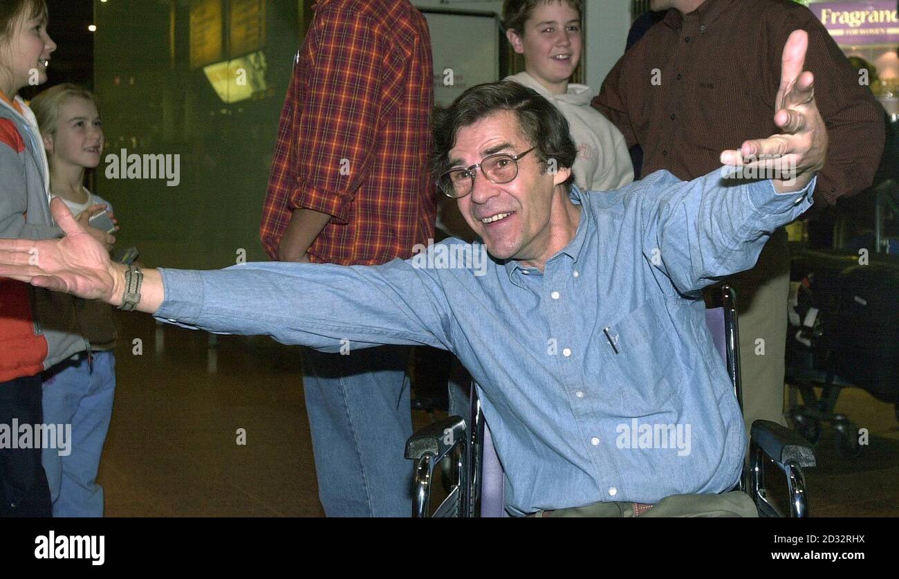 Ian Stillman, 52, holds his arms out to greet family and friends as he ...