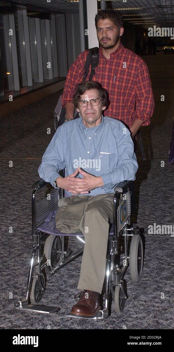 Ian Stillman, 52, is pushed though Heathrow Airport, London by his son ...