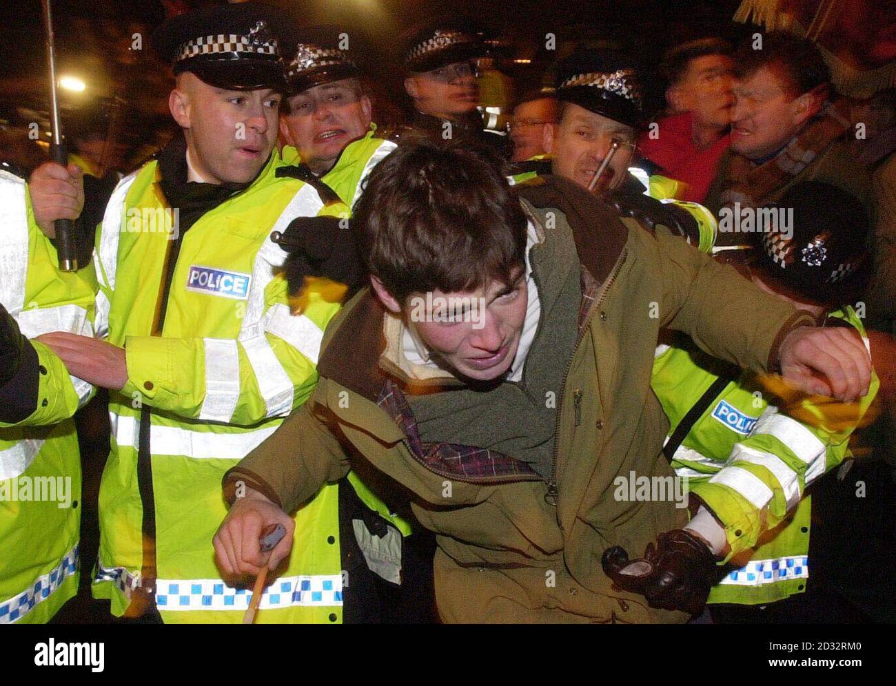 Police officers restrain demonstrators in Parliament Square, London ...