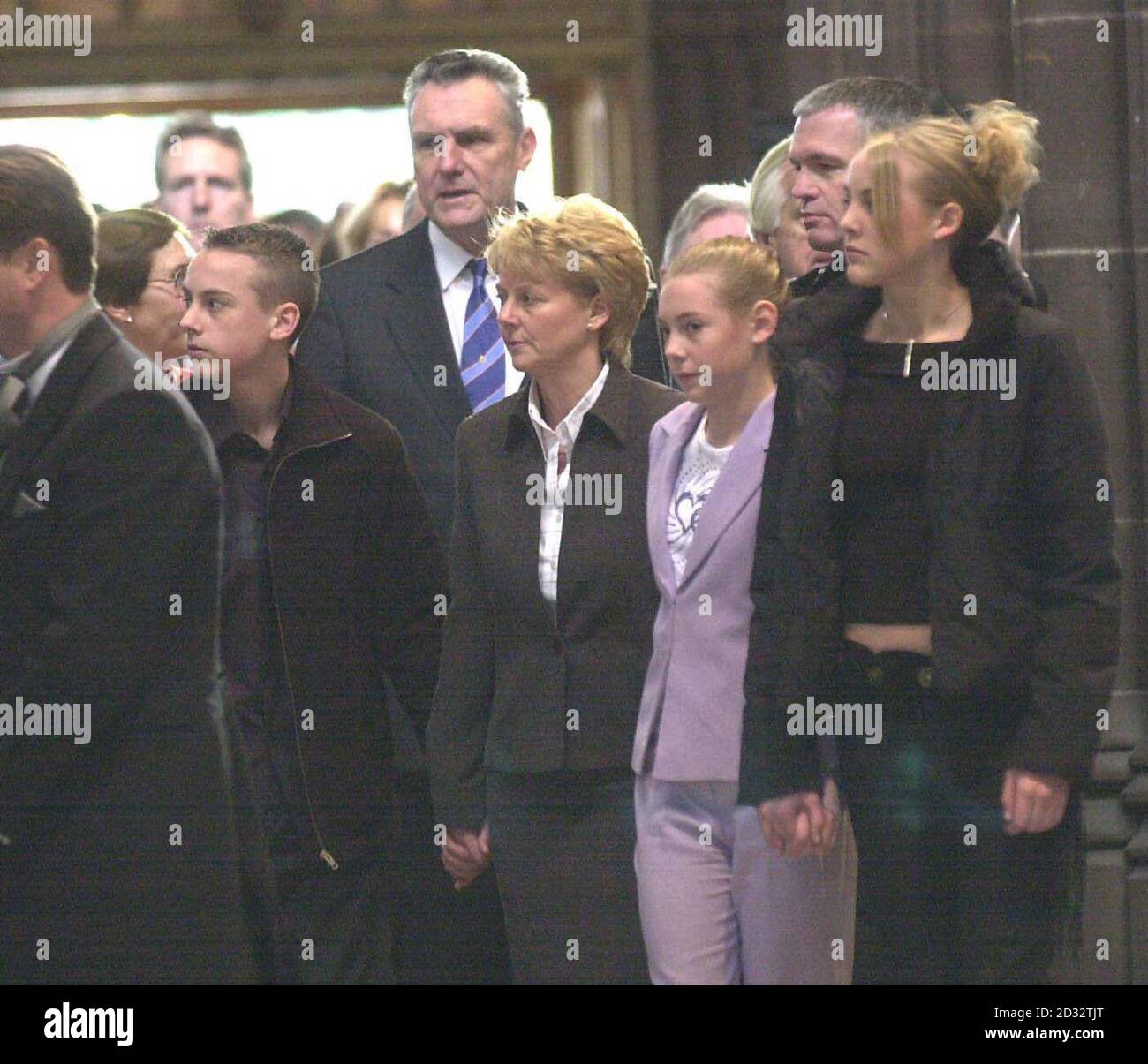 The coffin of Detective Constable Stephen Oake is followed in by his ...