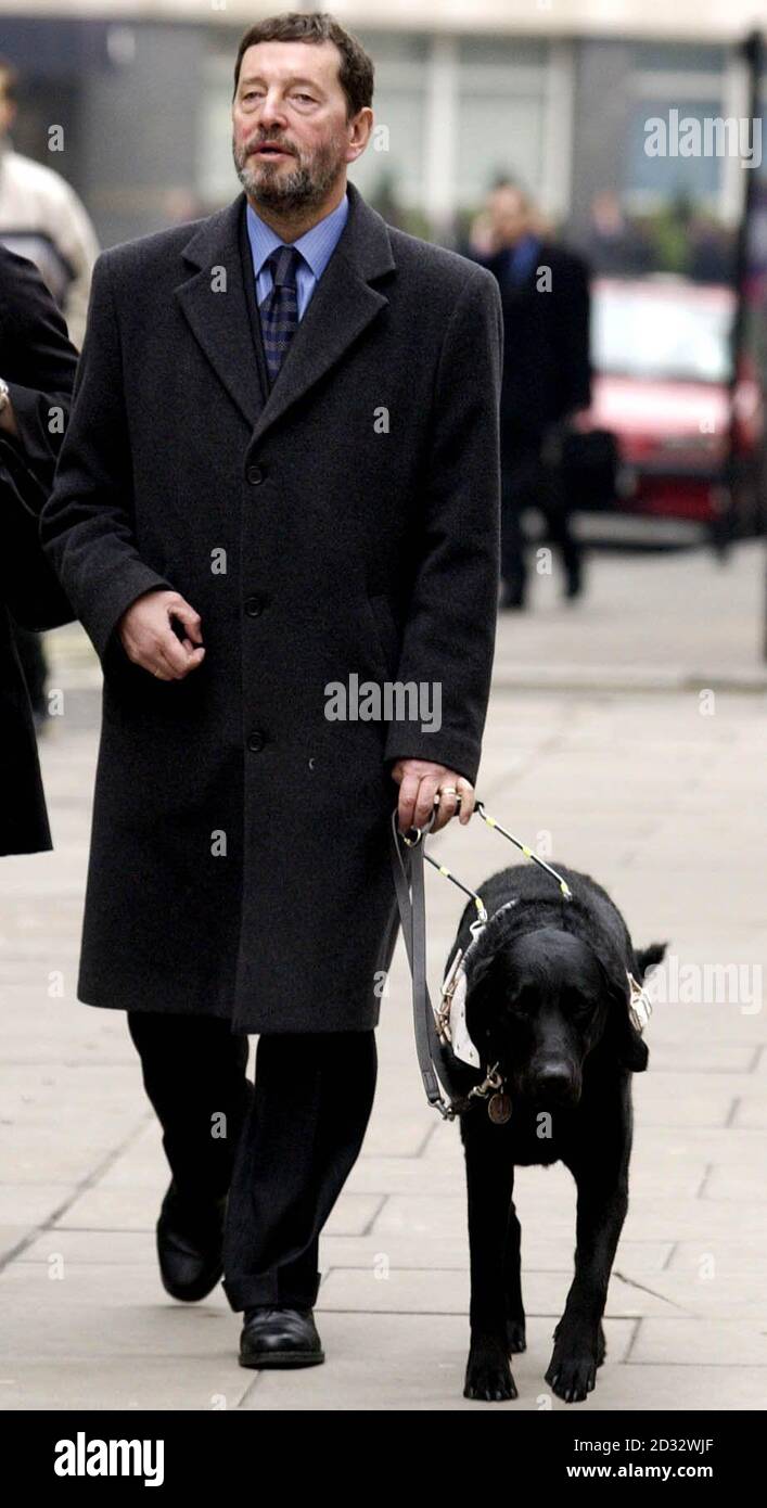 The Home Secretary David Blunkett arrives with his guide dog Sadie, at ...