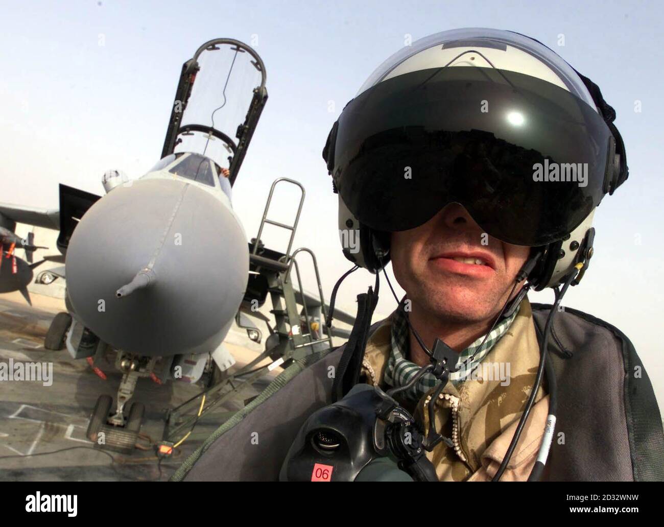 A British pilot walks away from his Tornado GR4 aircraft at an airbase ...