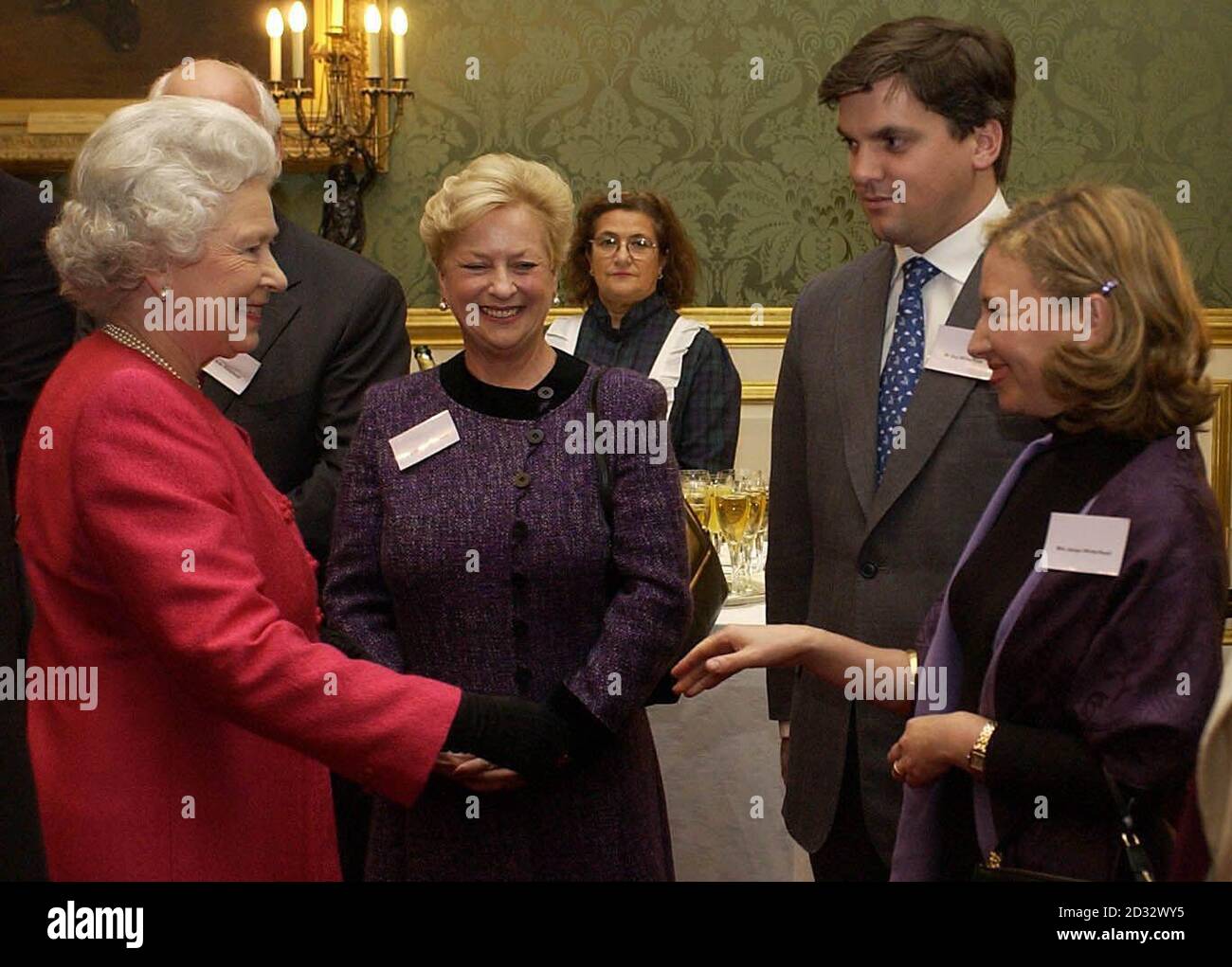 Queen Elizabeth II, greets Mr and Mrs Guy Winterflood while attending a ...