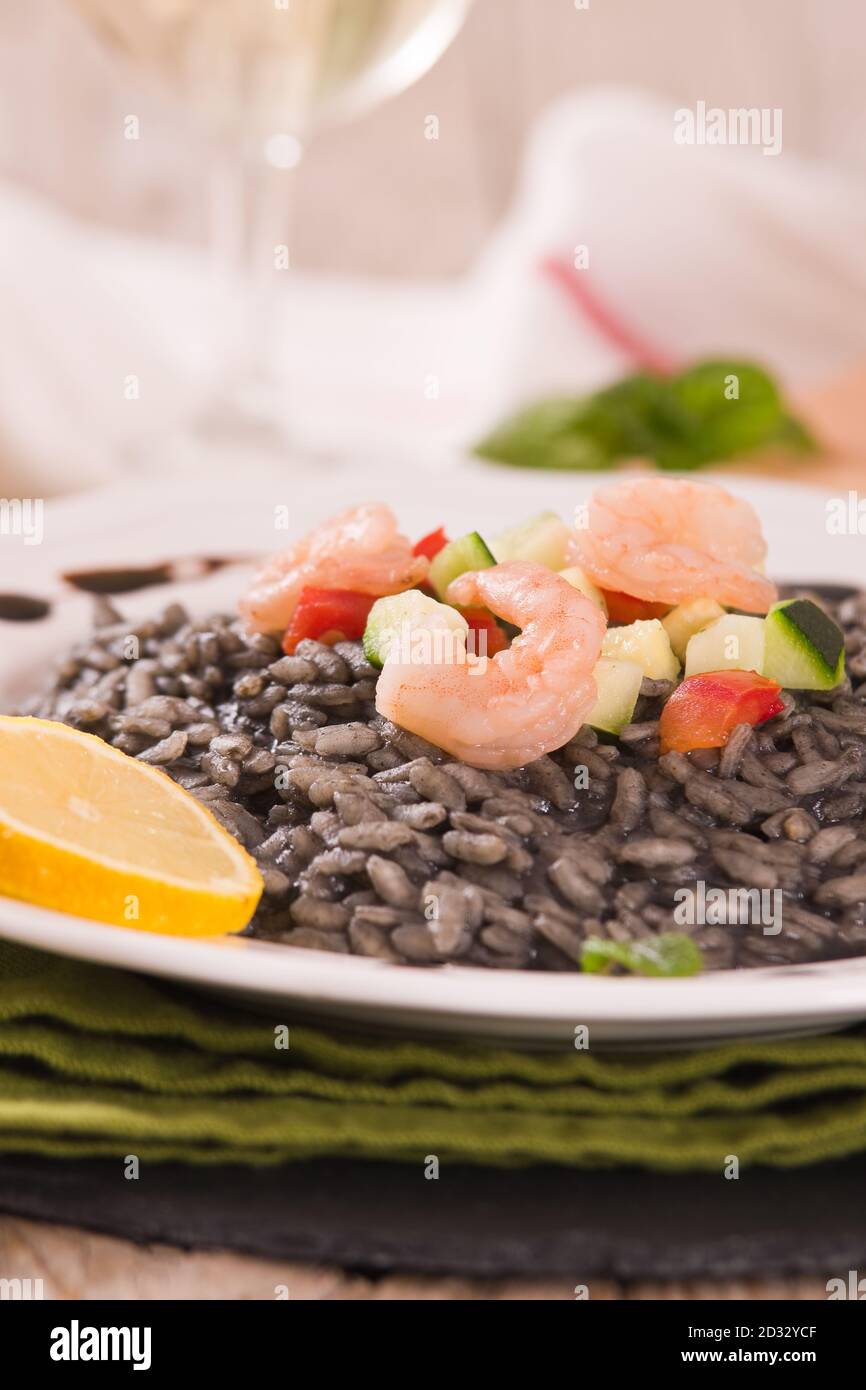 Squid ink risotto Stock Photo - Alamy
