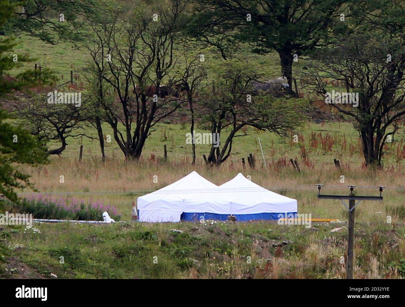 Previously unreleased photo dated 6/8/2013 of a police forensic tent at ...