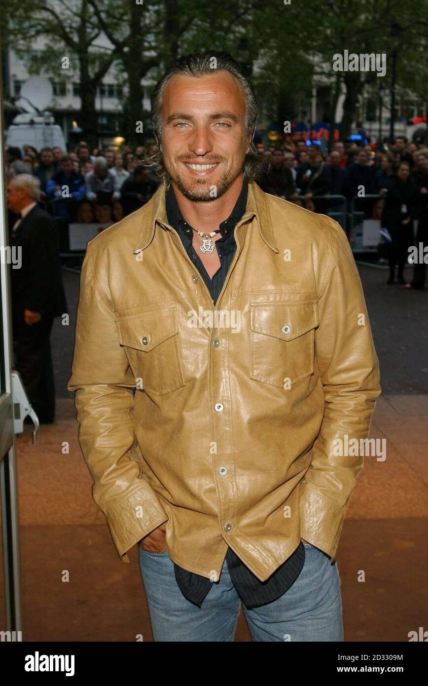 Footballer david ginola arriving odeon west end hi-res stock ...