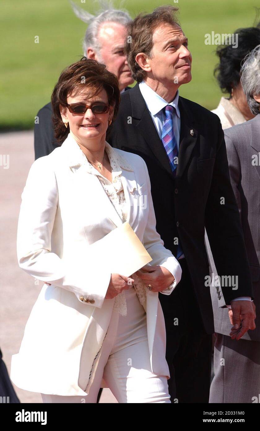 British Prime Minister Tony Blair with wife Cherie (left) arrive for ...