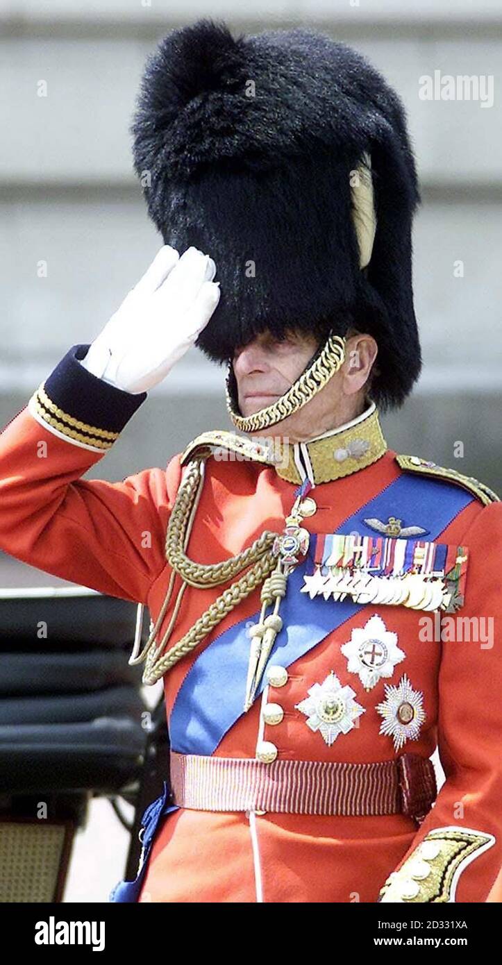 The Duke of Edinburgh takes a salute outside Buckingham Palace, London ...