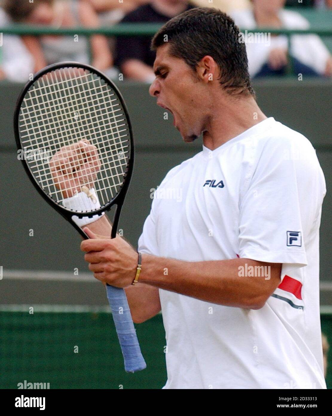 Mark Philippousis celebrates winning the 4th set against Andre Agassi ...