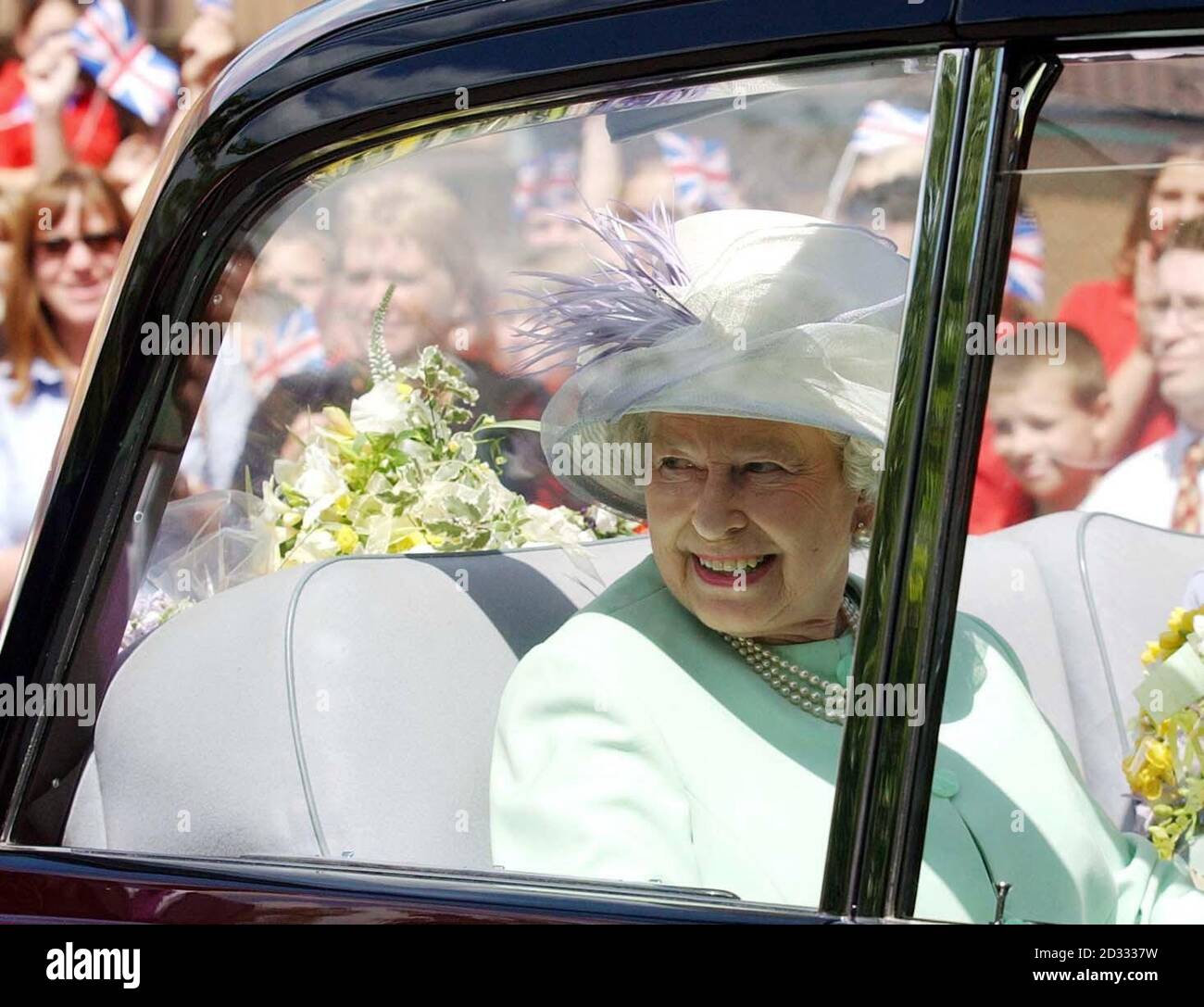 Britain's Queen Elizabeth II leaves following her visit to John Kyrle ...