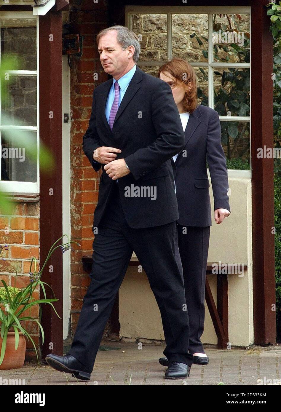 Defence Secretary Geoff Hoon leaves, after visiting Janice Kelly, the ...