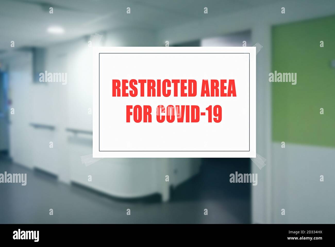 Sign on the door of a hospital corridor indicating an access area ...