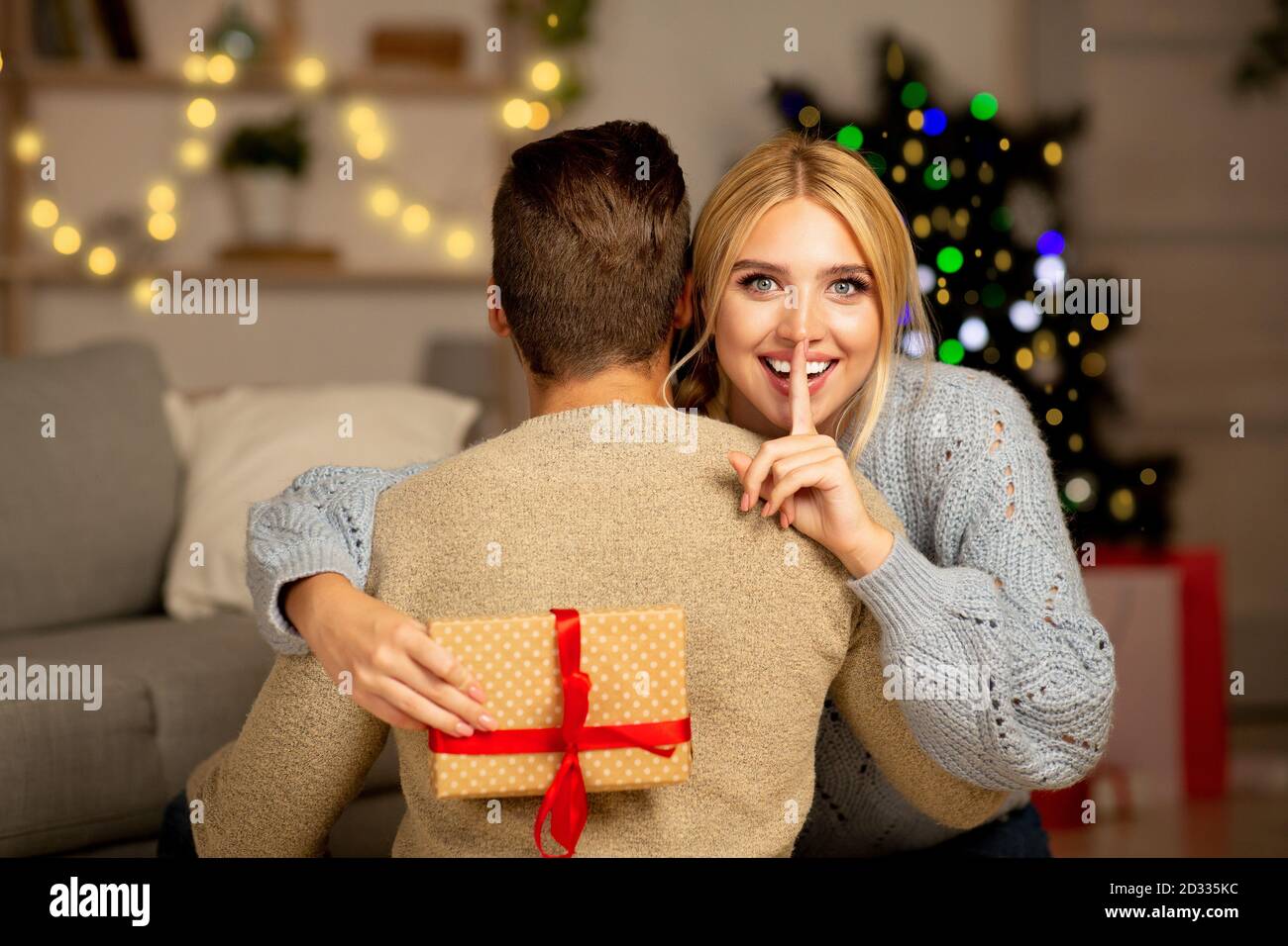 Gift box hugging hi-res stock photography and images - Alamy