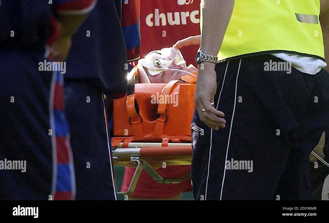 Referee Paul Danson is carried off, after being knocked unconscious ...