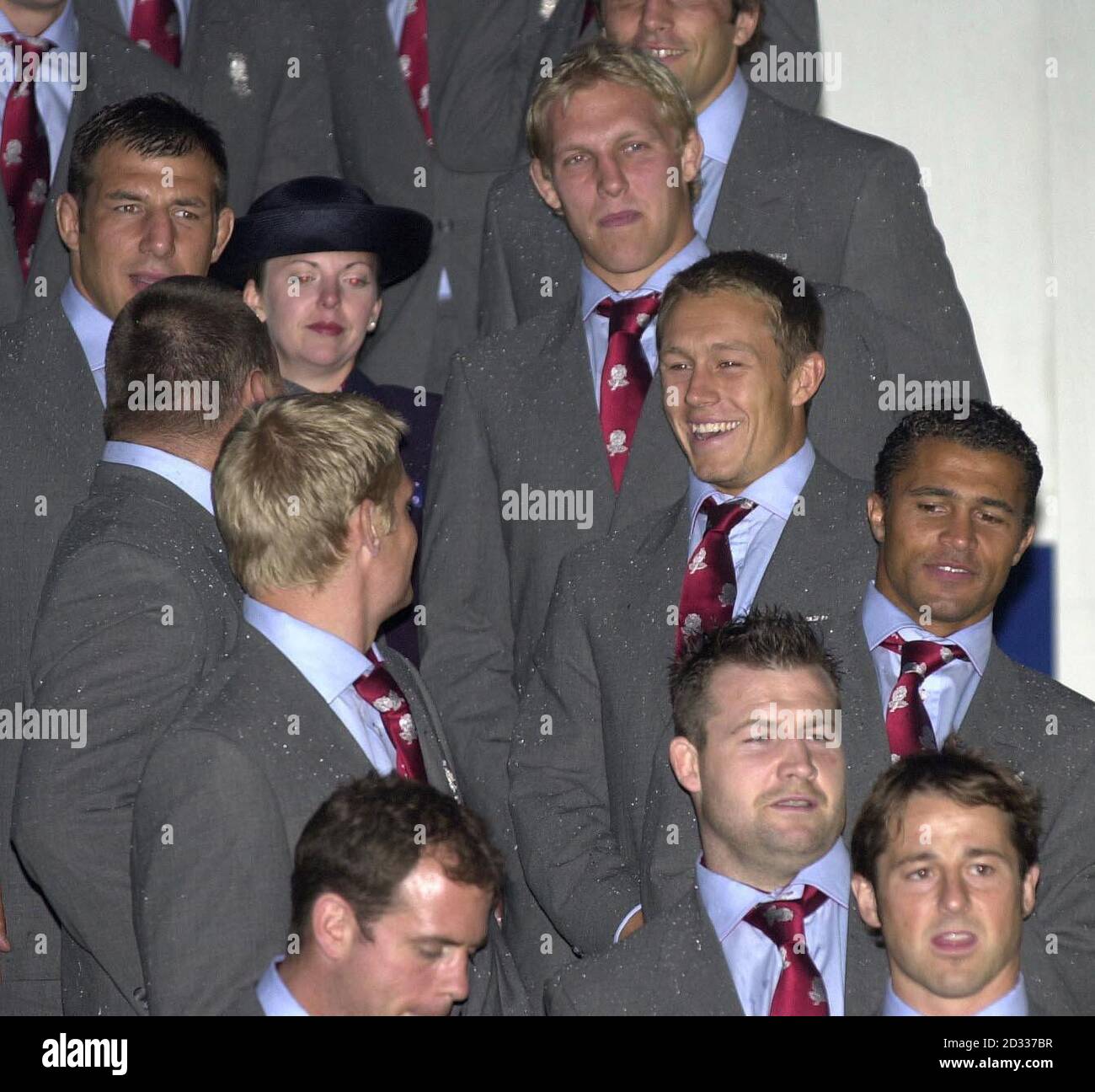 Members of England's Rugby World Cup squad pose on the steps of a BA ...