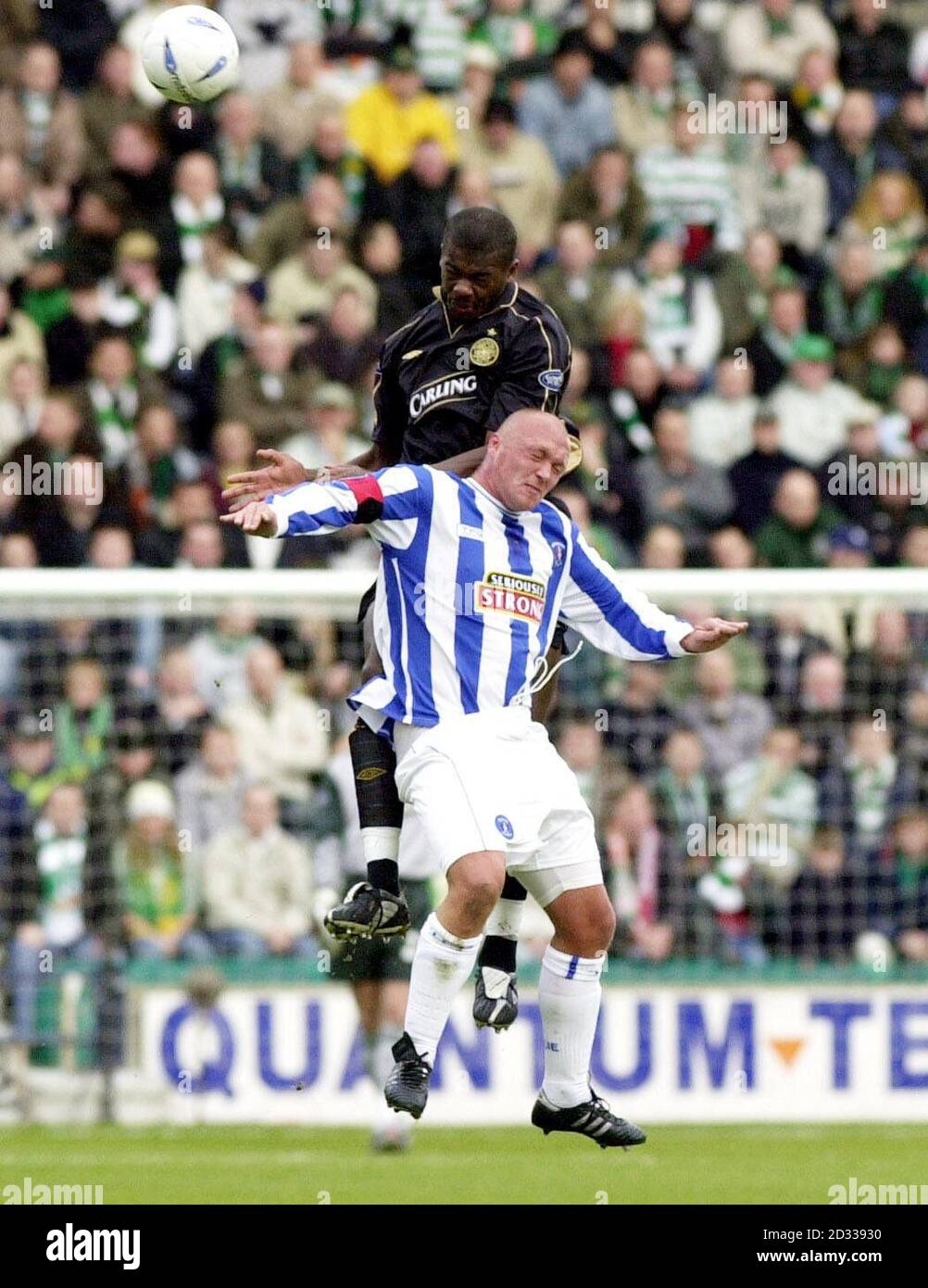 EDITORIAL USE ONLY Celtic's Bobo Balde (top) wins the header against ...