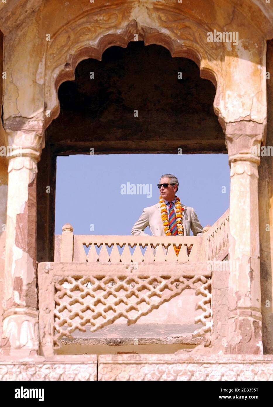 The Prince of Wales, studies the view from the rooftops during his ...