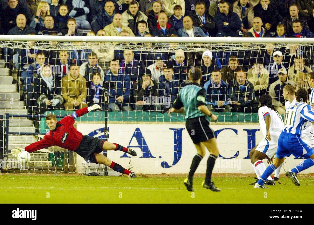 EDITORIAL USE ONLY: Kilmarnock's Peter Canero (far right) scores past ...