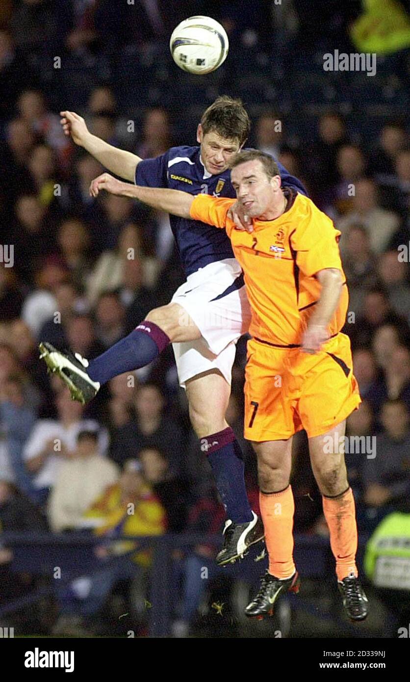 Scotland's Gary Naysmith (left) in action against Holland's Andy Van ...