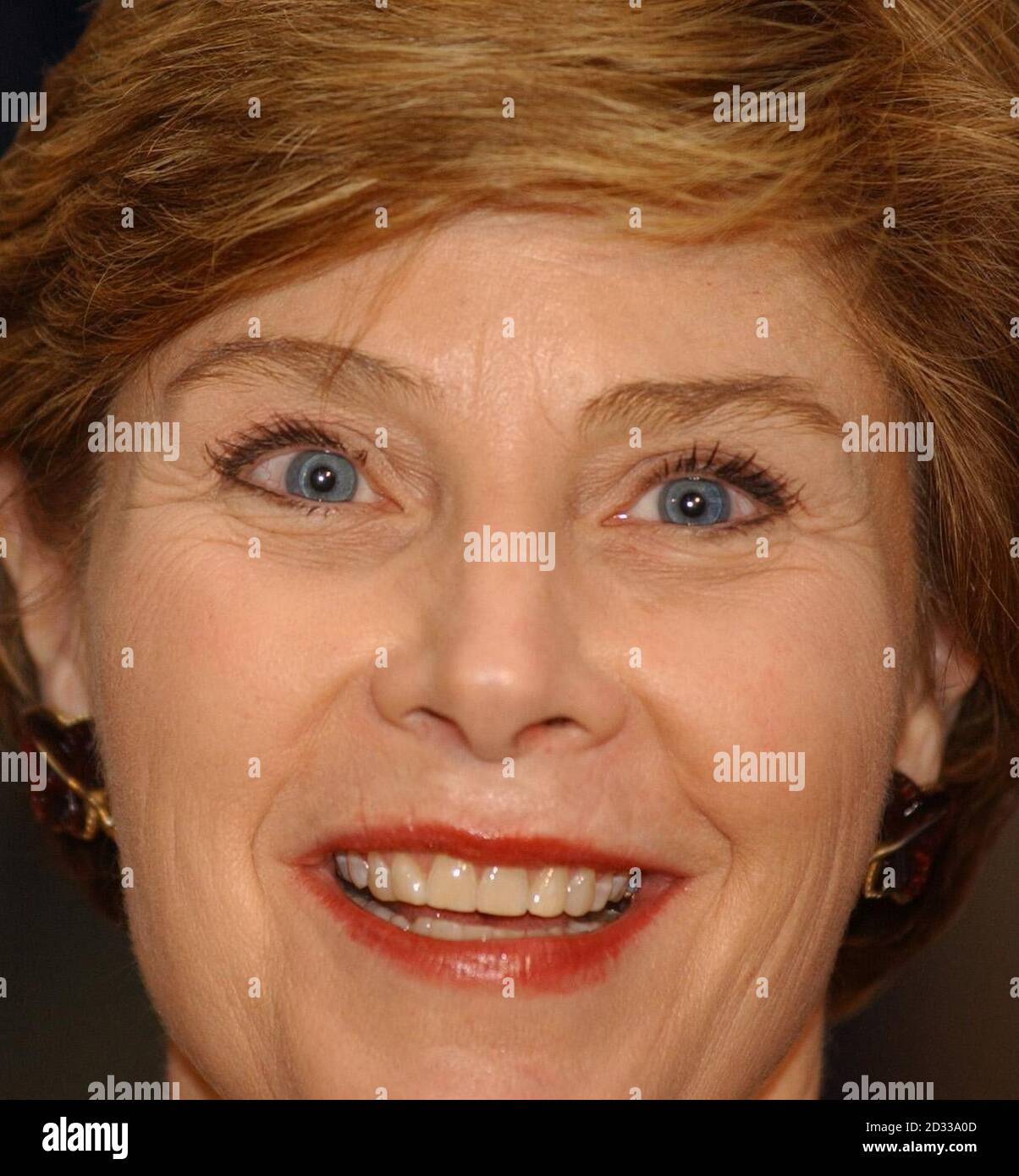 First Lady Laura Bush smiles, as she tours a display of Faberge items ...