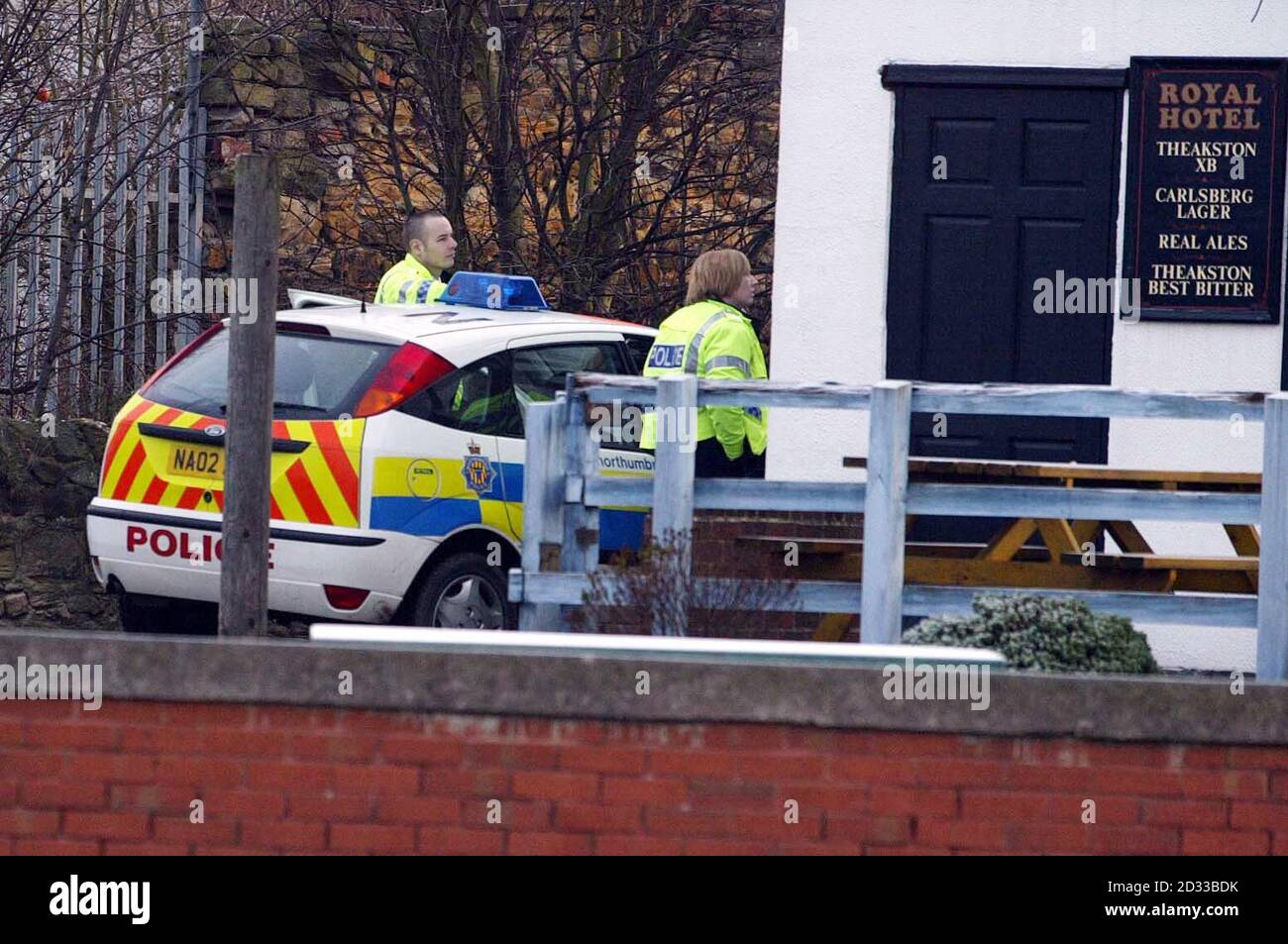 Police officers stand on guard outside the Royal Hotel in Dunston ...