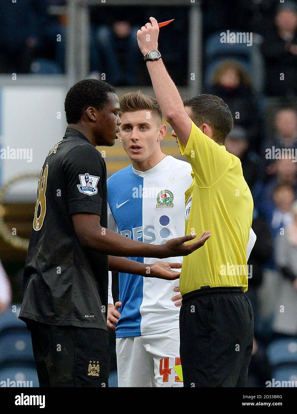 Referee Michael Oliver shows Manchester City's Dedryck Boyata the red ...