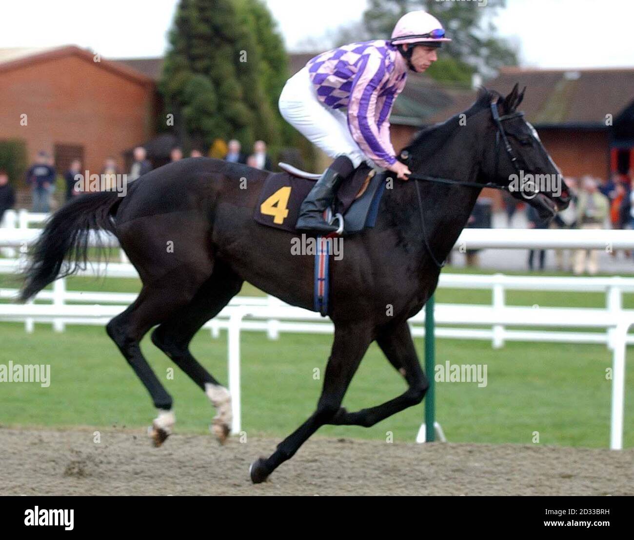 Keep on Movin with jockey Robert Miles at Lingfield Park, Surrey Stock ...