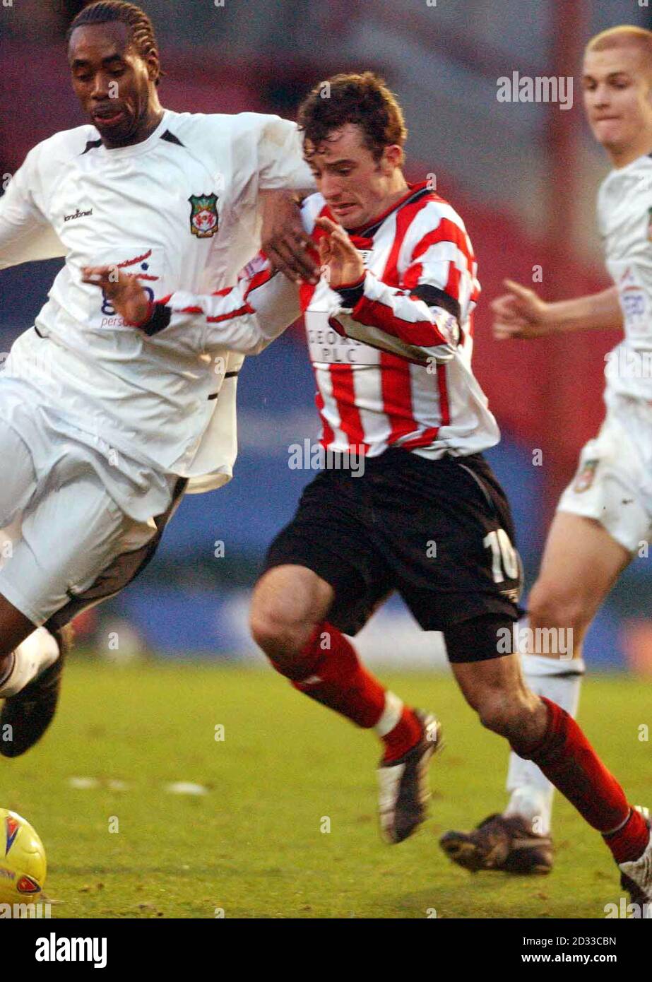 Brentford's Stephen Hunt and Wrexham's Dennis Lawrence in action at ...