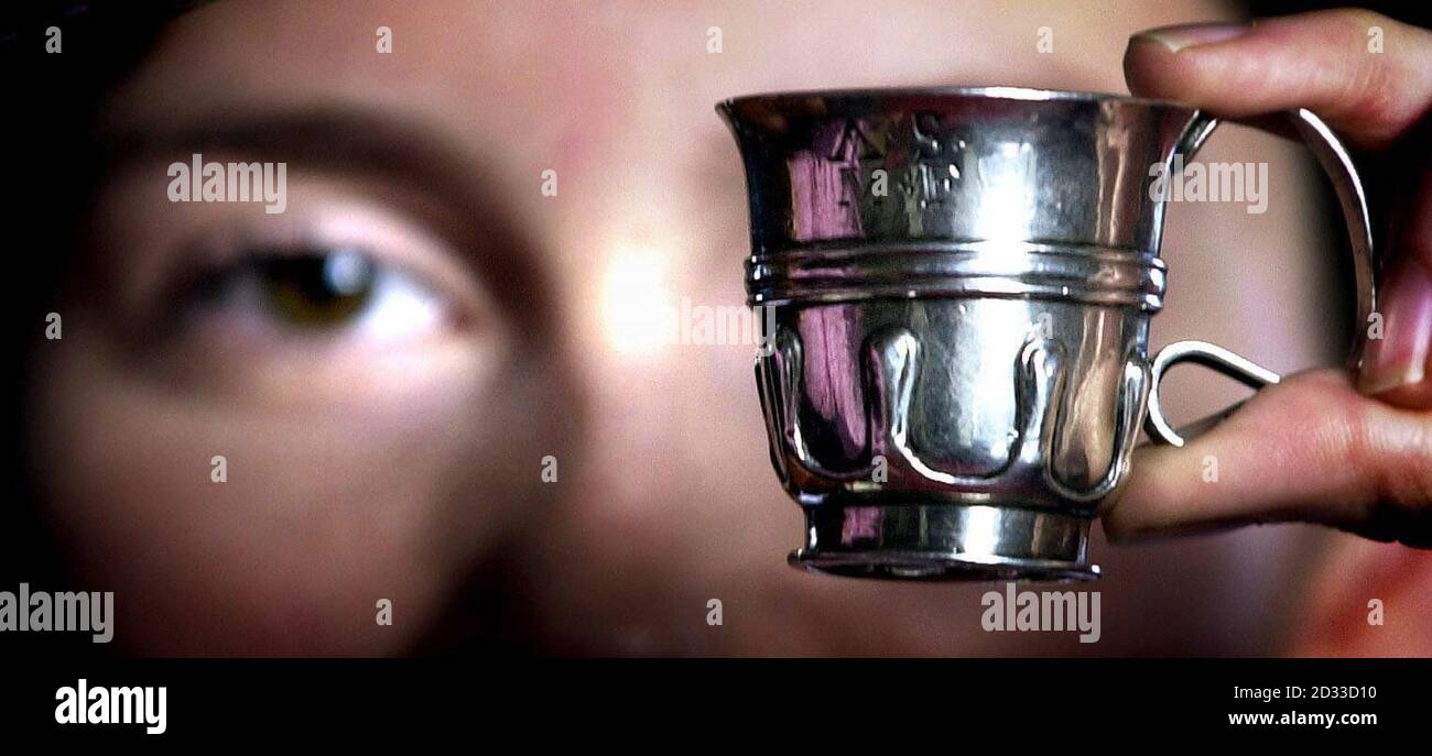 Polly Roberts holds aloft a rare silver dram cup put on display, at ...