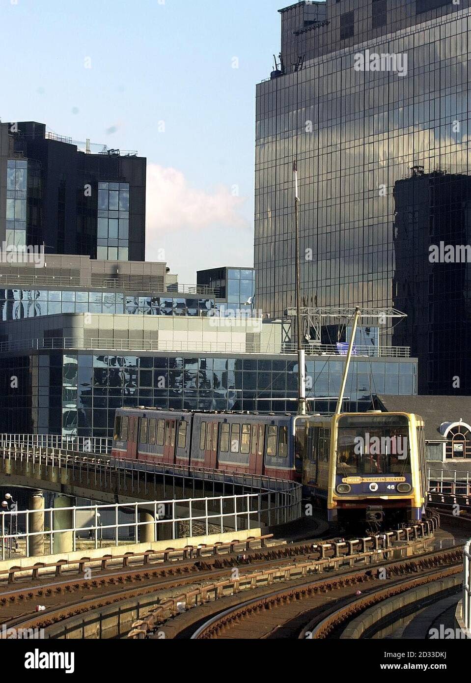 A train runs on the Docklands Light Railway Line in London, as plans ...