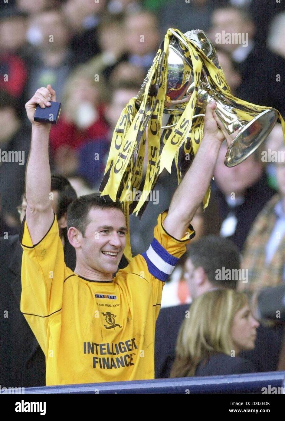 Livinston's Stuart Lovell lifts the CIS Cup after the CIS Insurance Cup ...