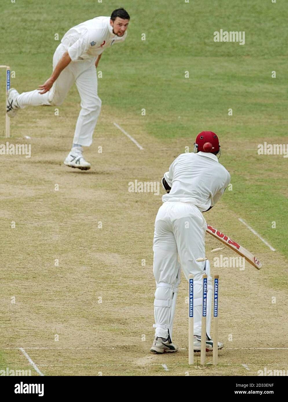 England's Stephen Harmison (top) clean bowls West Indian batsman Pedro ...