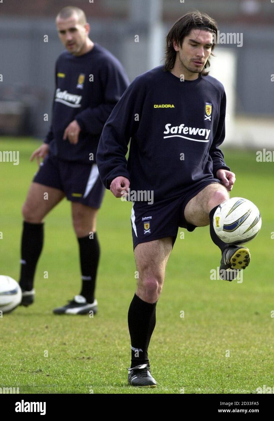 EDITORIAL USE ONLY: Scotland's Richard Hughes watched by team-mate Paul ...