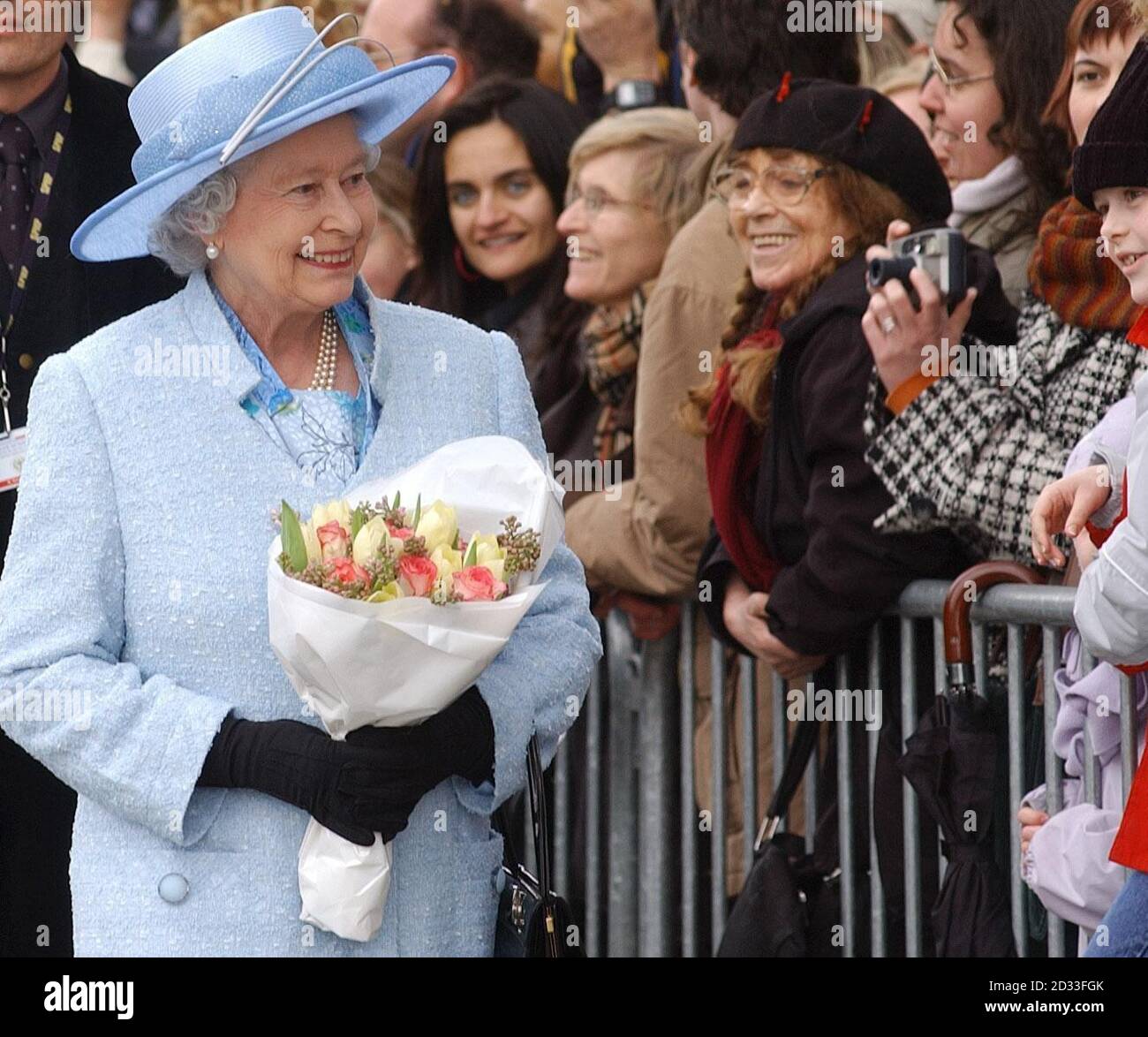 Britain's Queen Elizabeth II meets the French public during a walkabout ...
