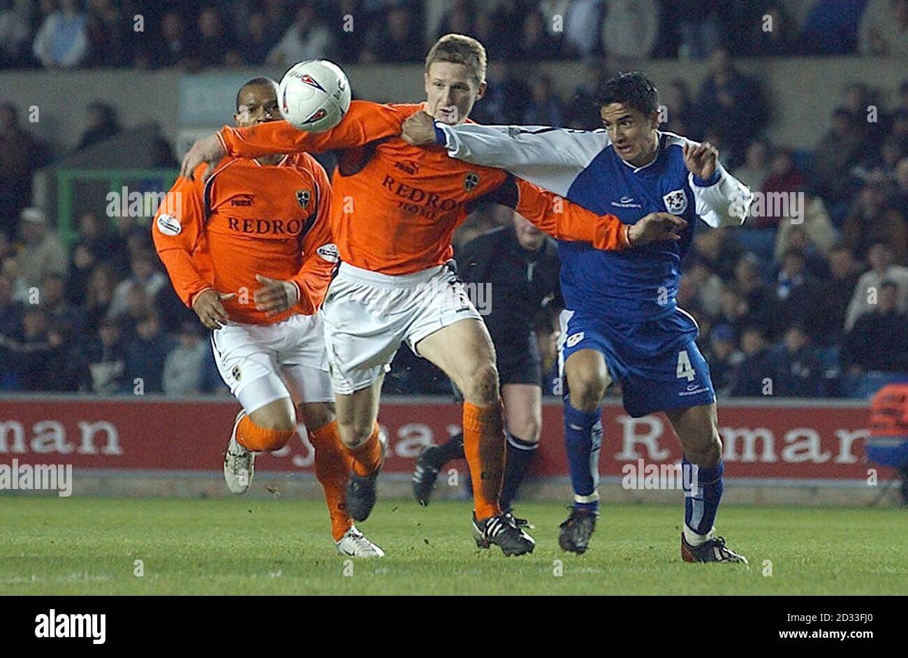Millwall's Tim Cahill (right) struggles to find a way past Cardiff's ...