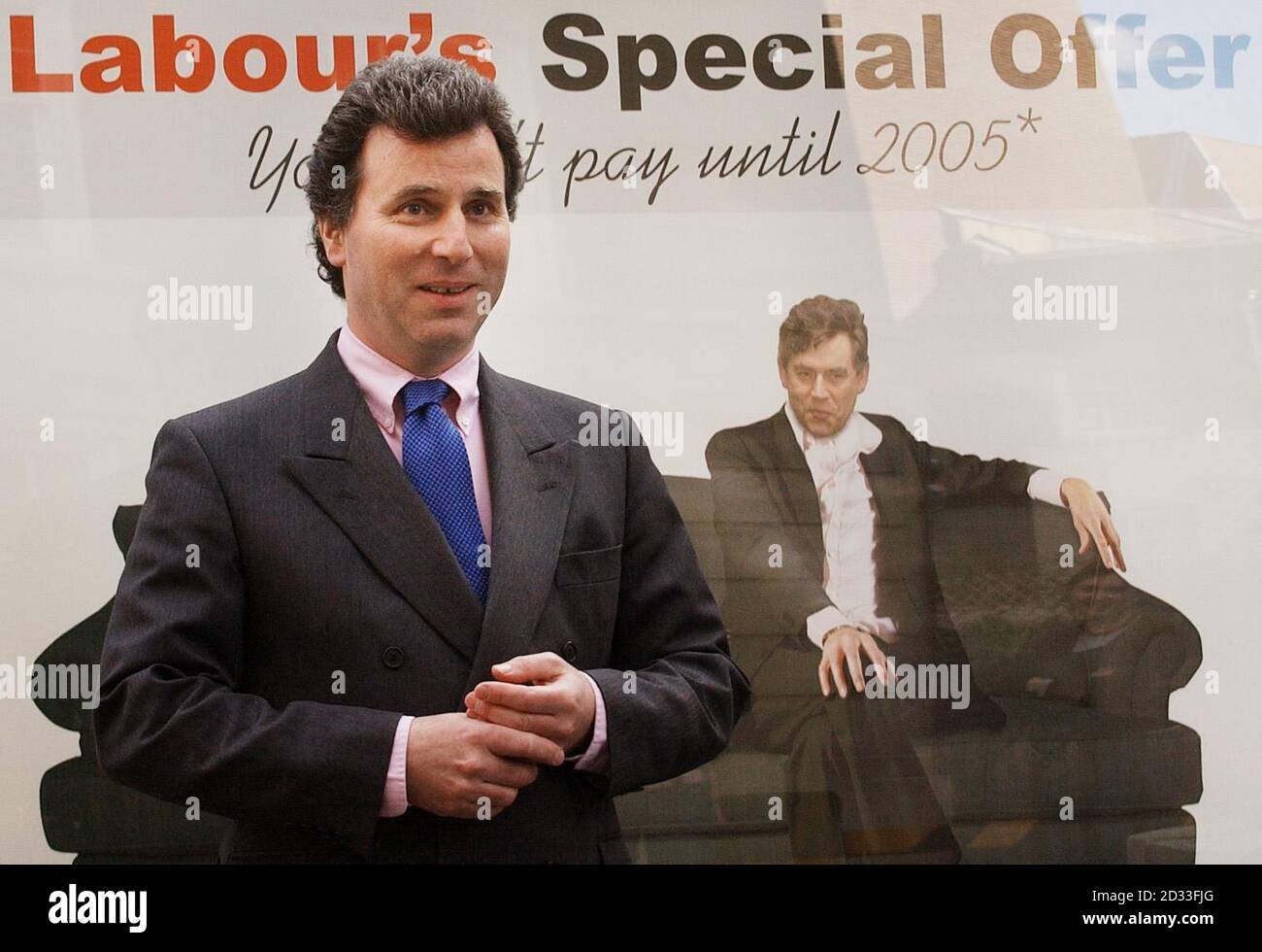 The Shadow Chancellor, Oliver Letwin stands in front of a new poster ...