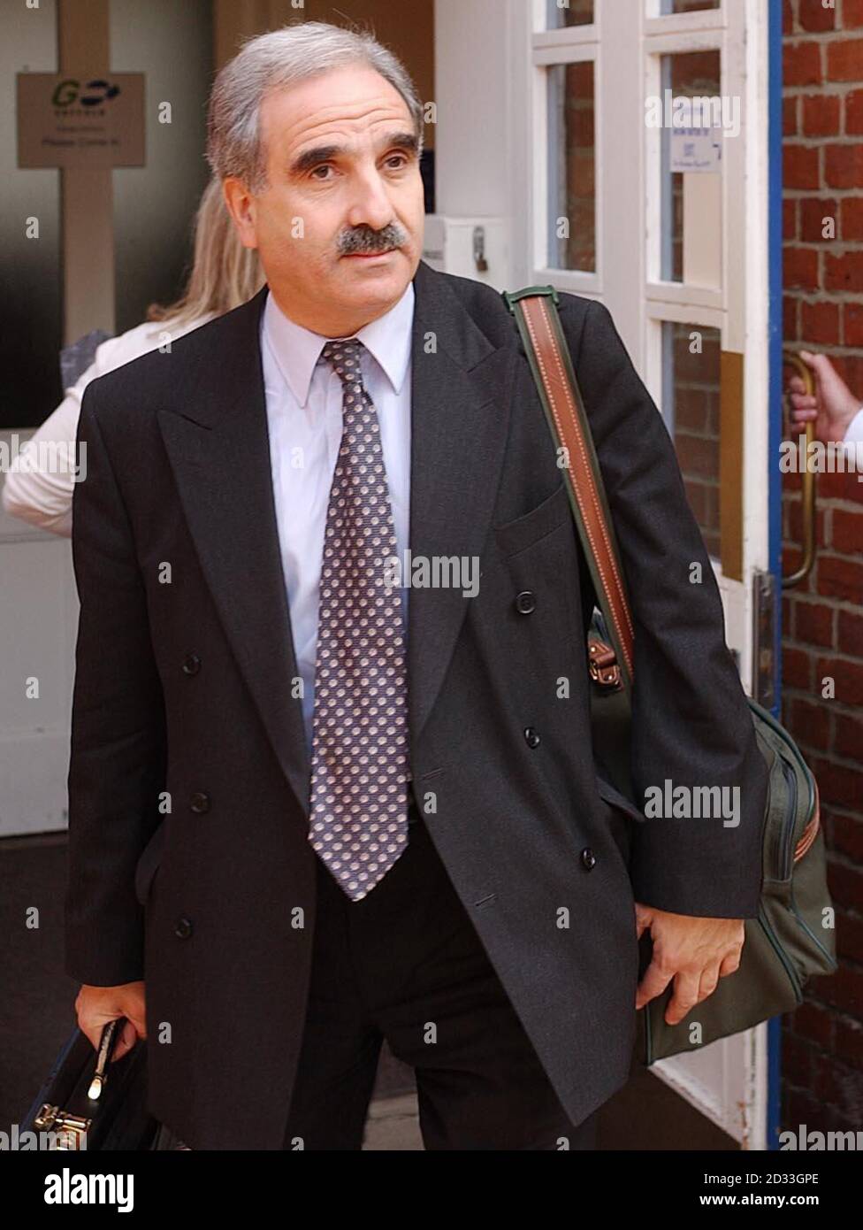 Coroner for Greater Suffolk Dr. Peter Dean arrives at Suffolk County ...