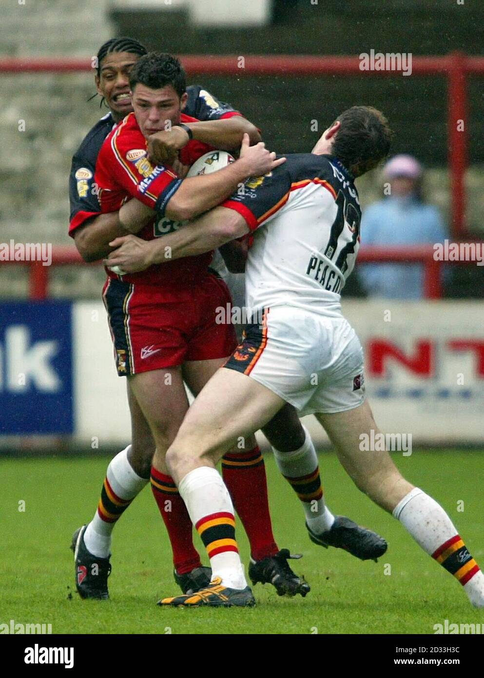 Bradford Bulls' Leon Pryce (left) and Jamie Peacock tackle London ...